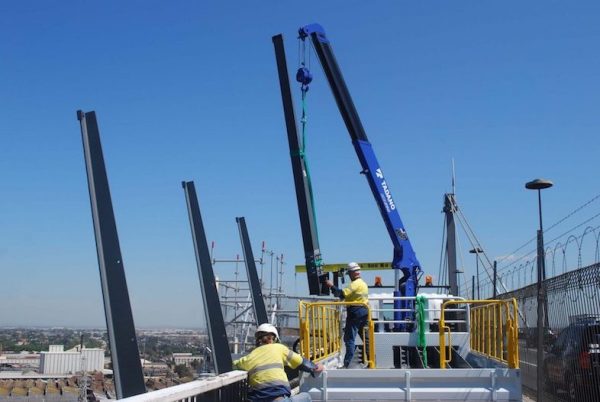 600 Cranes assist safety barrier installation on West Gate Bridge ...