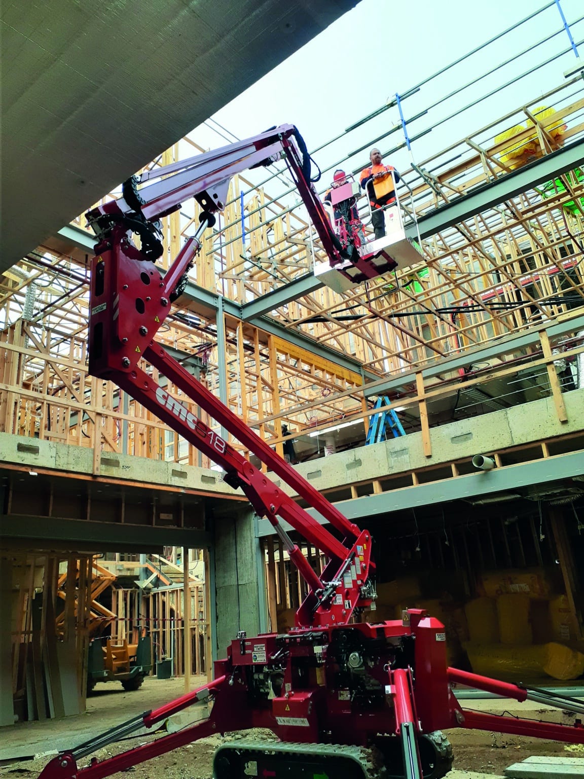 Hydraulic crawler aerial platform spider lifts an asset on site ...